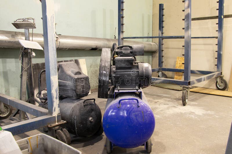 The Compressor is on the Floor in the Painter S Workshop, the Working ...