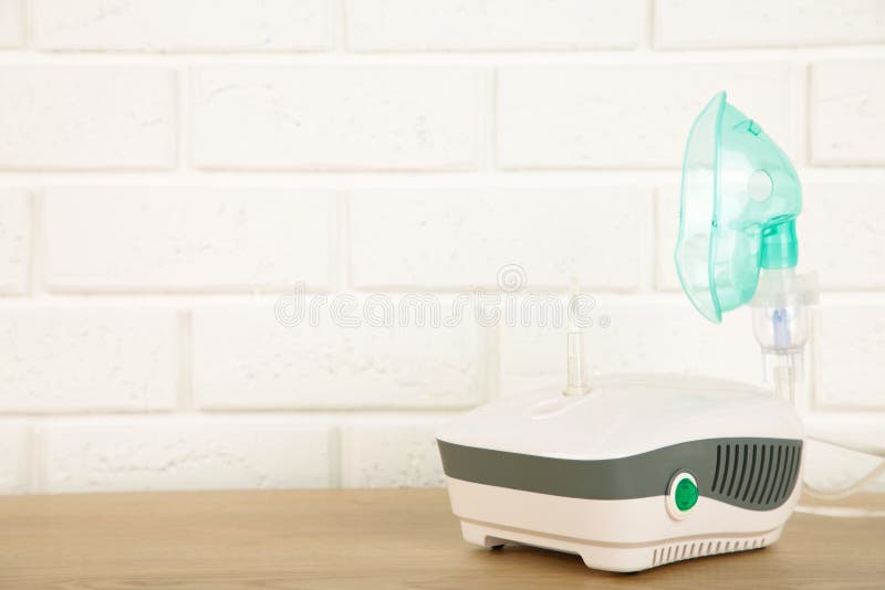 Compressor Nebulizer with Mask on Table. Top View Stock Image - Image ...