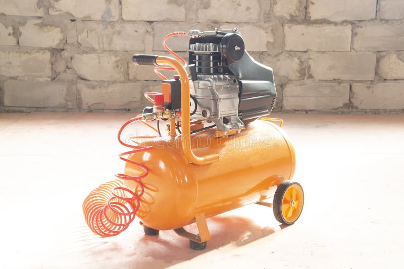 The Compressor is Portable.Using a Portable Compressor at Work Stock ...