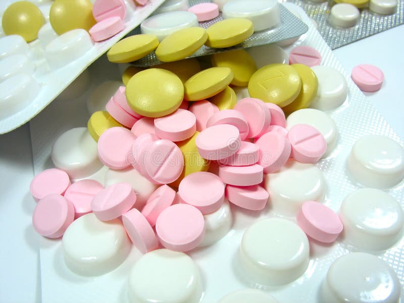 Comprimidos Brancos E Coloridos Da Droga Foto de Stock - Imagem de ...