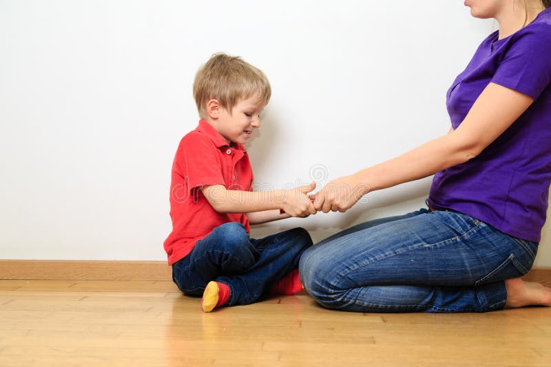Parent Pulling Child from Touch Pad Stock Photo - Image of parent ...