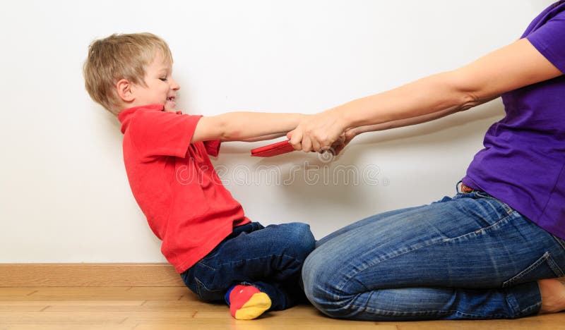 Parent Pulling Child from Touch Pad Stock Photo - Image of parent ...