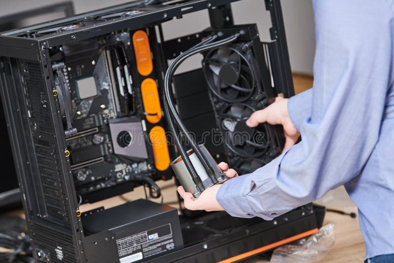 Computer Assembling Service. Serviceman Installing Liquid Cooling ...