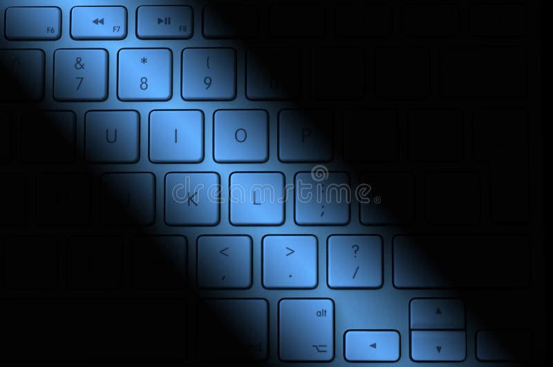 Shadows on laptop keyboard stock photo. Image of closeup - 24368022