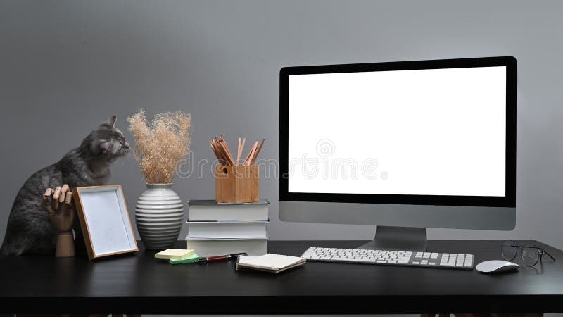Computer with Blank Screen and Cute Cat on Black Table. Stock Photo ...
