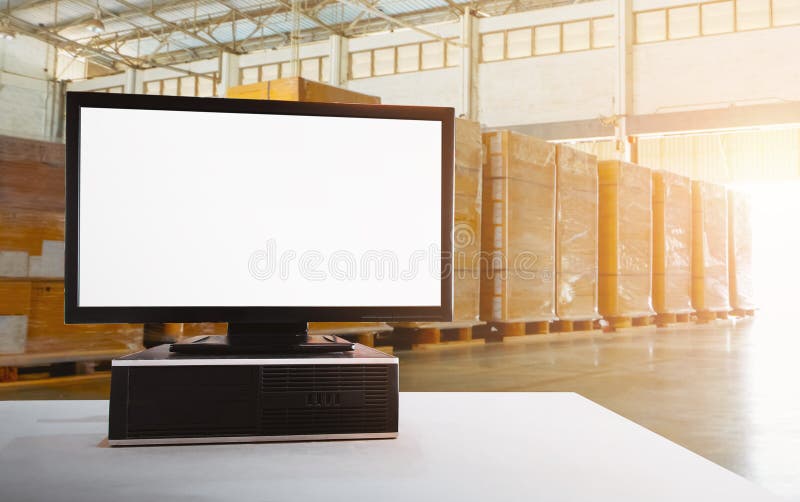 Computer Blank Screen on Table in Warehouse. Bulk Pallets of Package ...