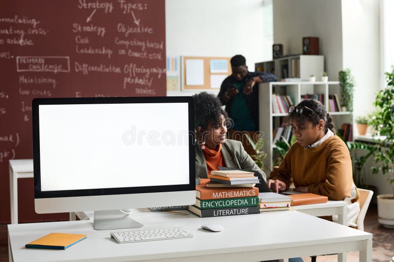 Computer with Blank White Screen on Table in Class Stock Image - Image ...
