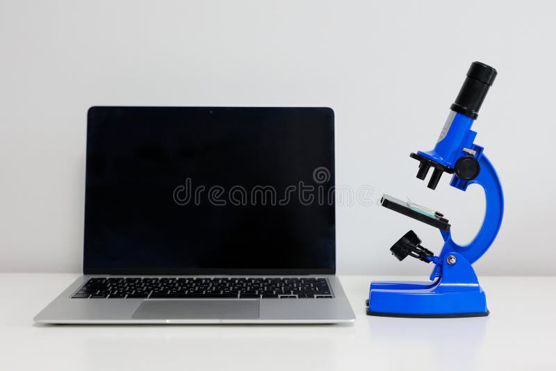 Computer and Blue Microscope on Table Stock Photo - Image of biological ...