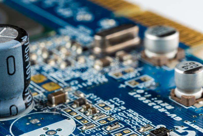 Computer Blue Motherboard With Microchips, Capacitors And Various ...
