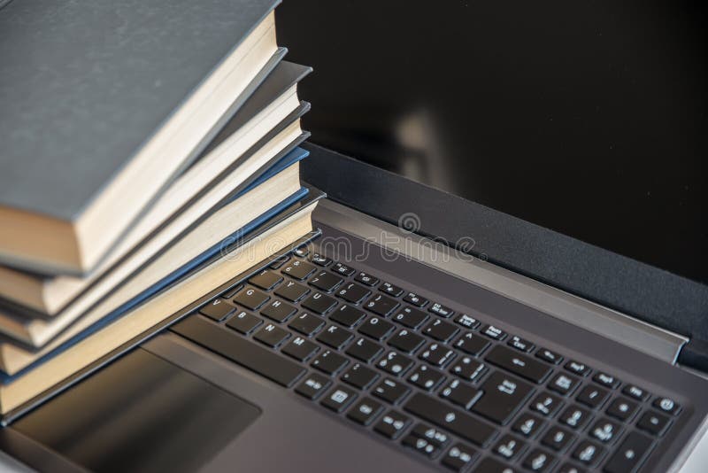 Computer, with Books Placed on the Keyboard. E-learning. Stock Photo ...
