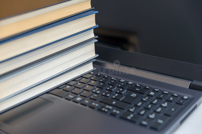 Computer, with Books Placed on the Keyboard. E-learning. Stock Photo ...