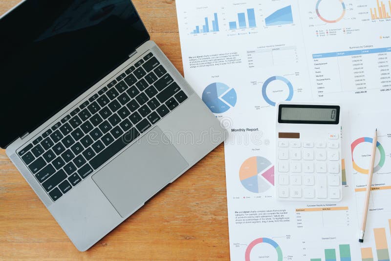 Computer, Calculator, Budget and Finance Documents and Pen on Wooden ...