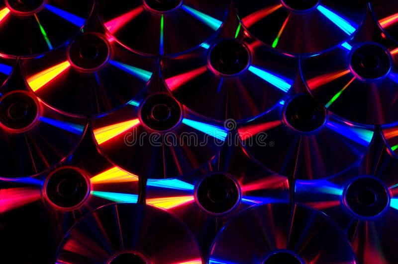 Computer CDs Under Colored Lights Stock Photo - Image of backup, write ...