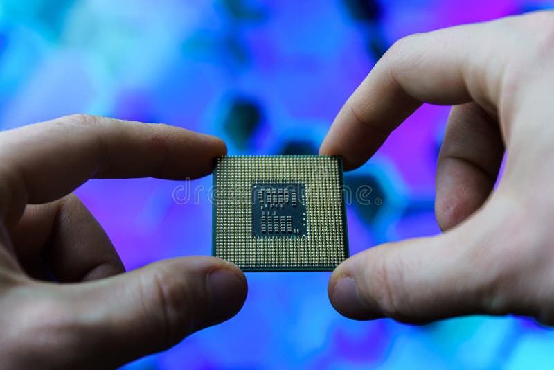 Computer Chip in Hands. a Chipset is a Set of Electronic Component that ...