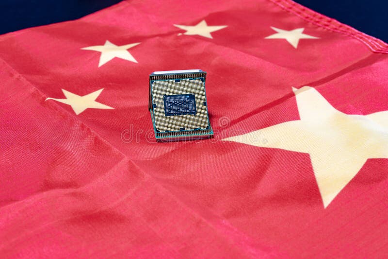 A Computer Chip Rests on a Chinese Flag, Illustrating Technological ...