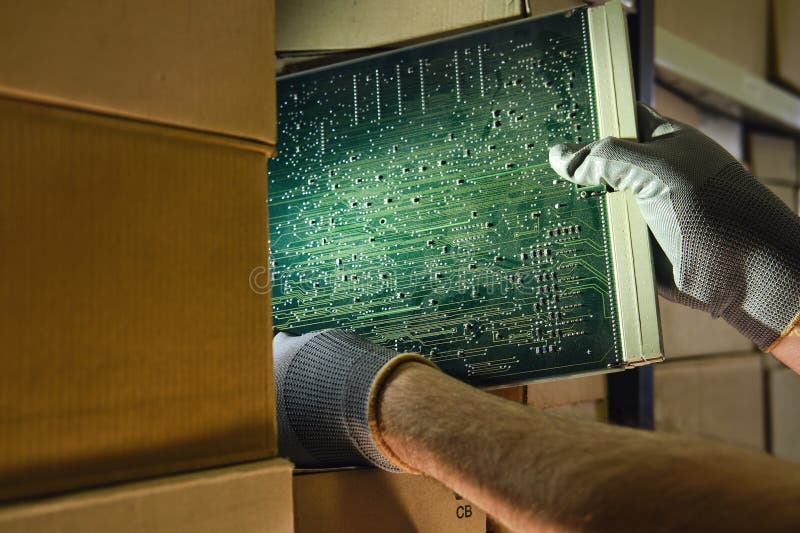 Computer Chips in the Hands of a Man Warehouse Worker. the Crisis of ...