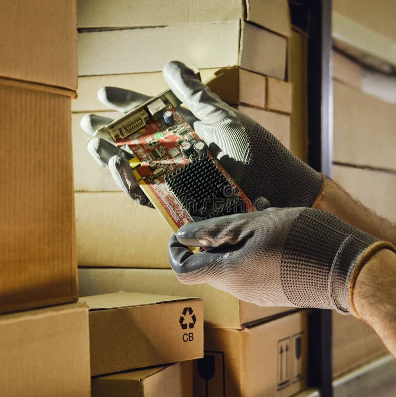 Computer Chips Video Card in the Hands of a Man Warehouse Worker. T ...