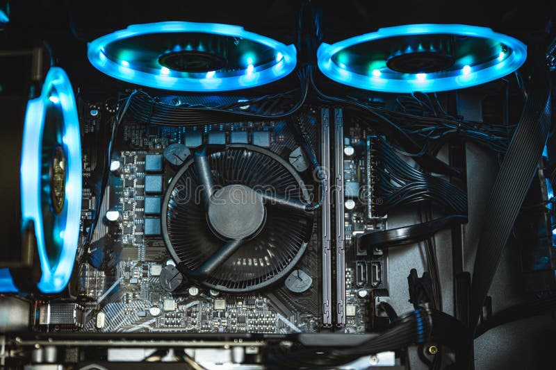 Computer Circuit Board and CPU Cooling Fans Illuminated by Internal LED ...