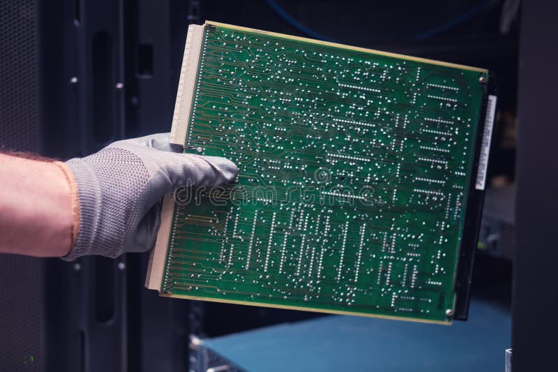 Computer Circuit Board in the Hands of a Man at the Server for Data Sto ...