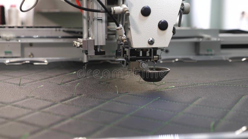 Robotics Works in the Tailoring Production Line. Robot Sewing Machine ...