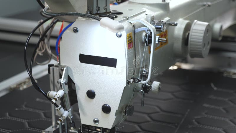 Computer Controls the Sewing Machine. Robotics Works in the Tailoring ...