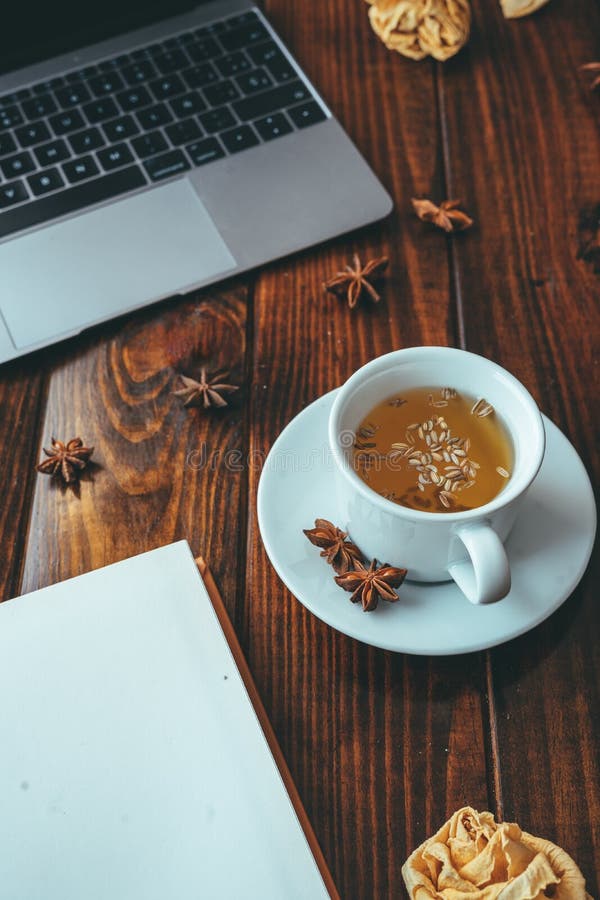 Computer, Cup of Tea and Notebook on a Wooden Table Stock Photo - Image ...