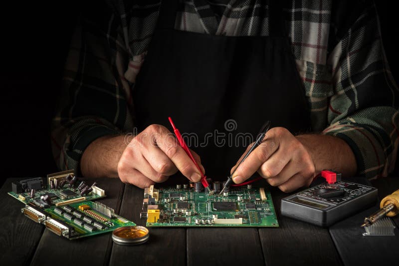 Computer Electronics Repair Master Tester Checks Electronic Board ...