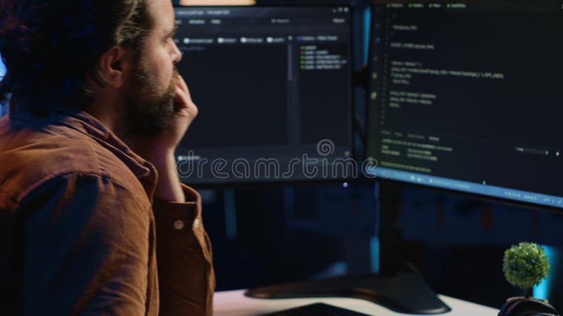 Computer Engineer Deliberating Ways Of Fixing Errors While Developing Code Stock Video Video