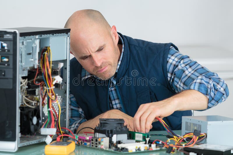 Computer Engineer Working on Broken Console Stock Photo - Image of ...