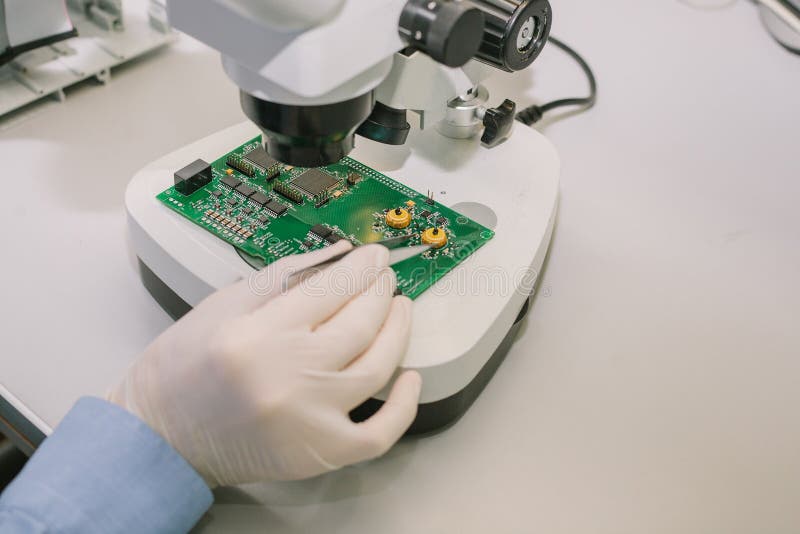Computer Expert Professional Technician Examining Board Computer in a ...