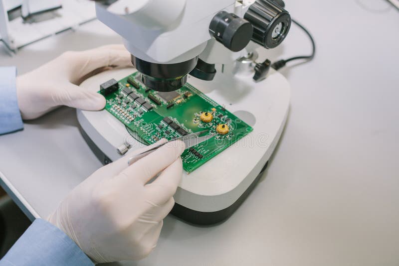 Computer Expert Professional Technician Examining Board Computer in a ...