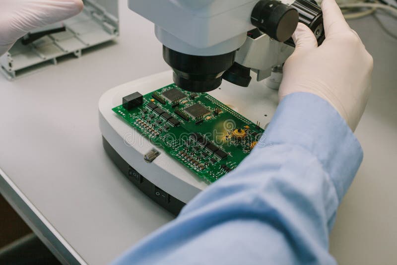 Computer Expert Professional Technician Examining Board Computer in a ...