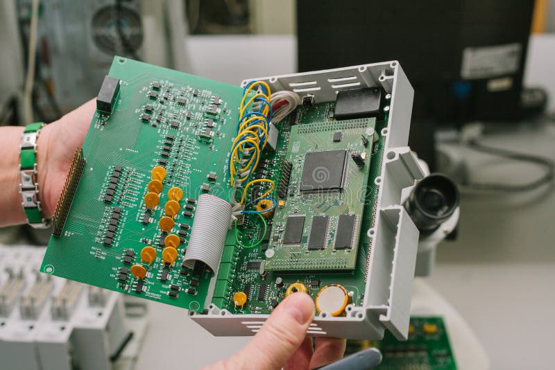 Computer Expert Professional Technician Examining Board Computer in a ...