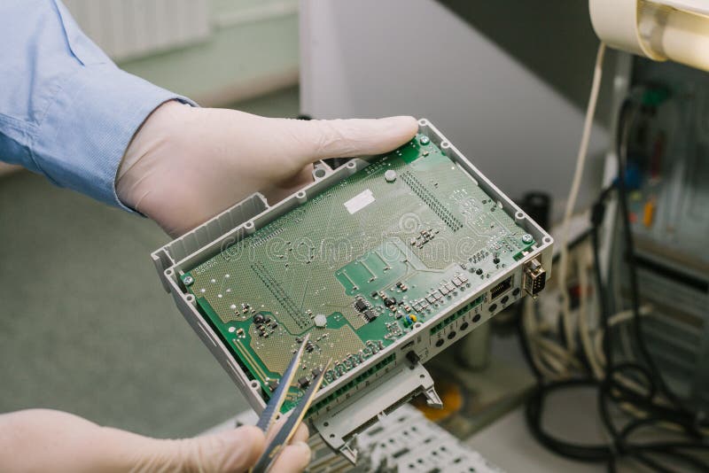 Computer Expert Professional Technician Examining Board Computer in a ...