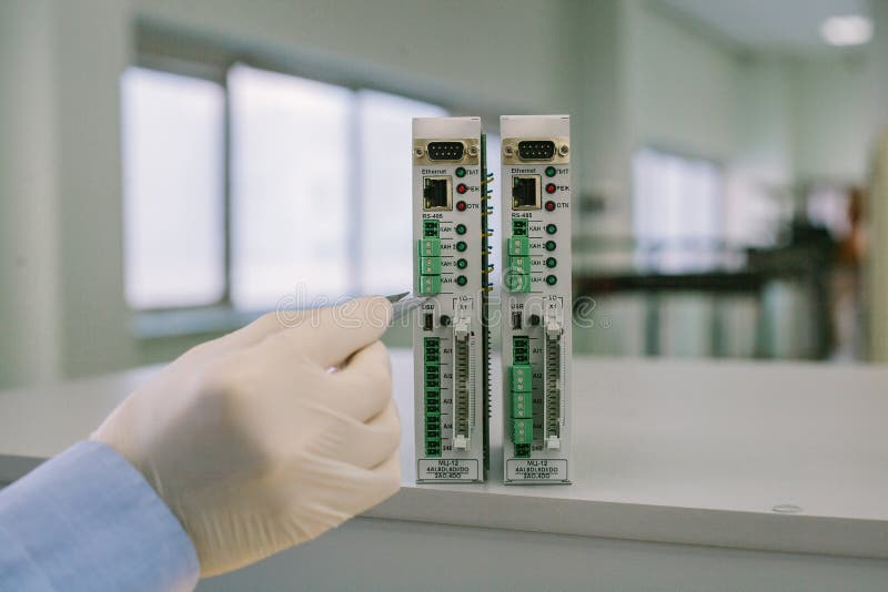 Computer Expert Professional Technician Examining Board Computer in a ...