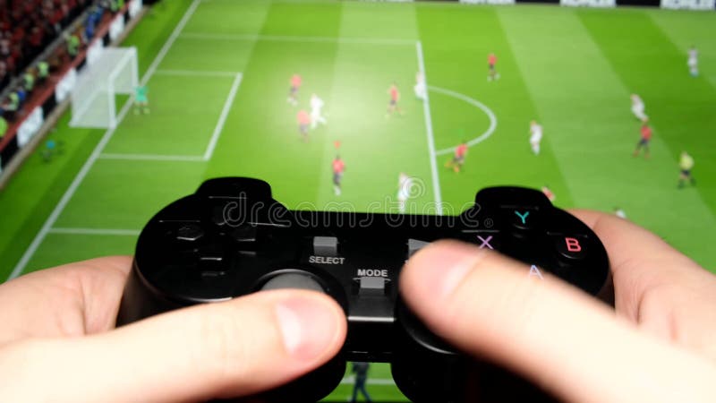 Computer Game of Football with the Help of a Console. Close Up Stock ...