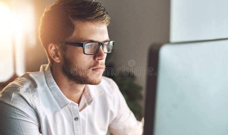 Computer, Glasses and Man in Office for Research on Software ...