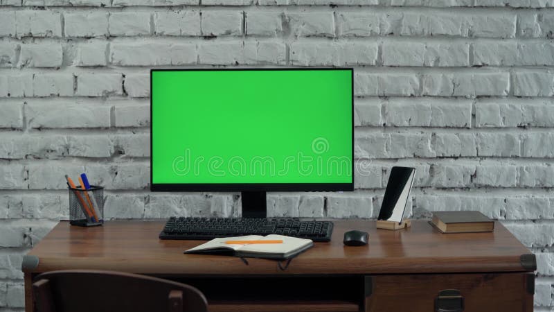 Computer with Green Screen Mockup on Desktop in Office. Background ...