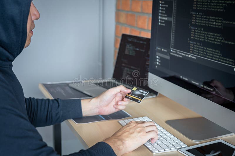 Computer Hacker or Cyber Attack Concept, Dangerous Hooded Hacker Using Multiple Computers Typing ...