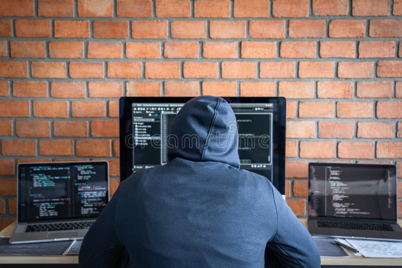 Computer Hacker or Cyber Attack Concept, Dangerous Hooded Hacker Using ... Computer Hacker or Cyber Attack Concept, Dangerous Hooded Hacker Using ...