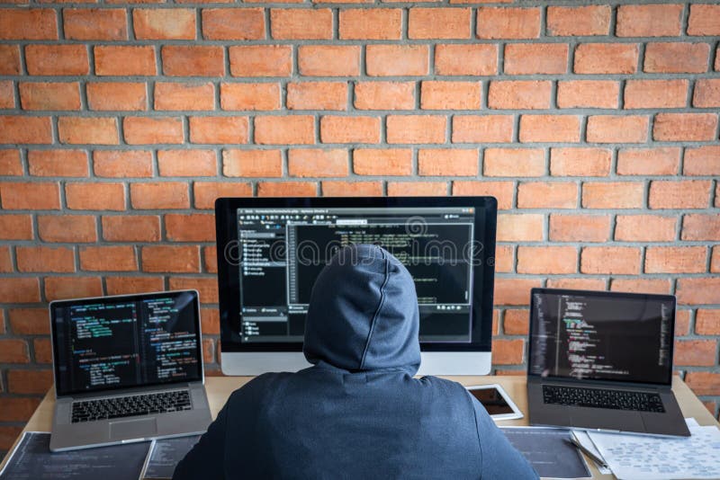 Computer Hacker or Cyber Attack Concept, Dangerous Hooded Hacker Using Multiple Computers Typing ...