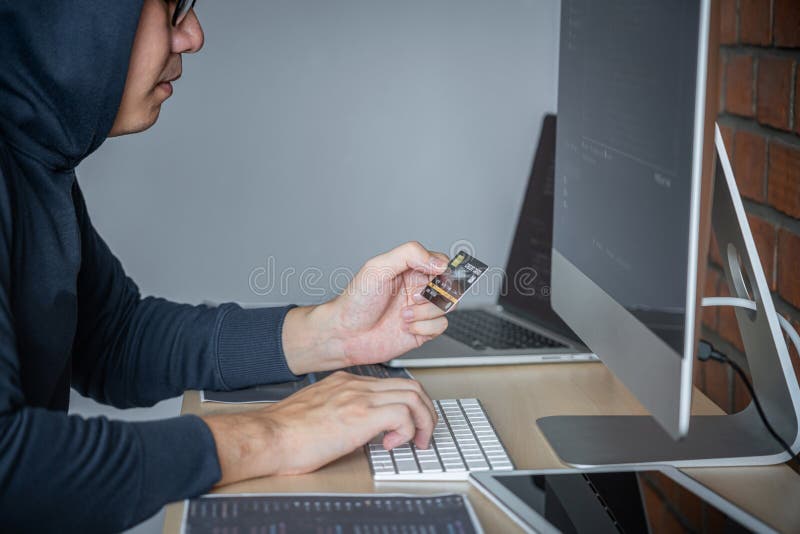 Computer Hacker or Cyber Attack Concept, Dangerous Hooded Hacker Using Multiple Computers Typing ...
