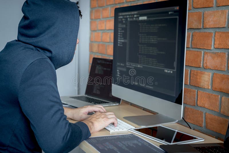 Computer Hacker or Cyber Attack Concept, Dangerous Hooded Hacker Using Multiple Computers Typing ...