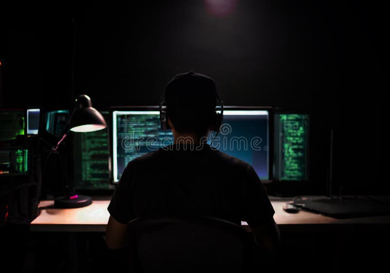 Computer Hacker Operating Computer System in a Dark Room Stock ...