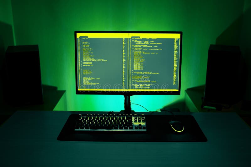 Computer Hacker Table and Personal Computer in a Green Dark Room. Stock ...