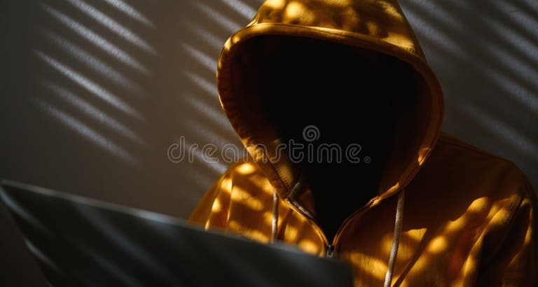 Computer Hacker Wearing Yellow Hoodie Using Laptop Stock Photo - Image ...