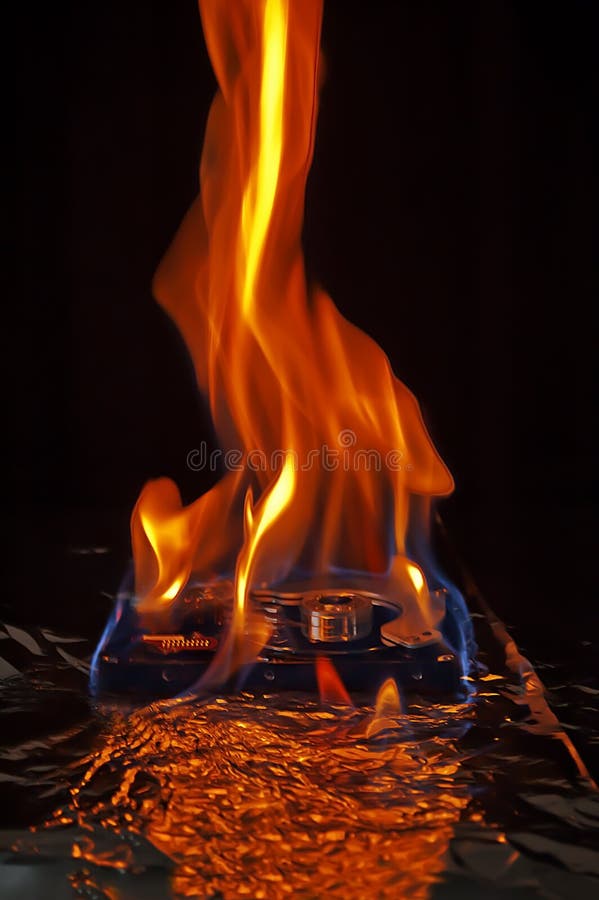 Computer hard disk on fire stock photo. Image of burn - 28387920