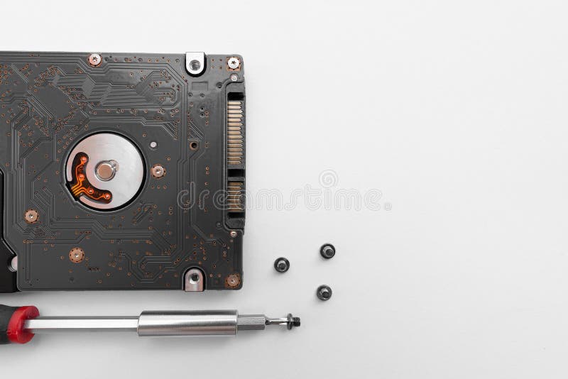 Hard drive and screwdriver stock image. Image of disk - 247474577