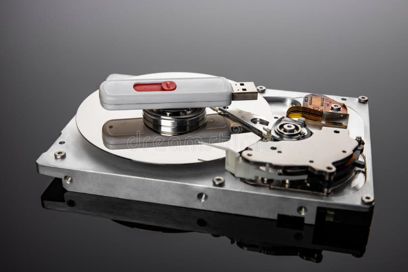 Computer Hard Drive and Flash Drive on a Gray-black Gradient Background ...