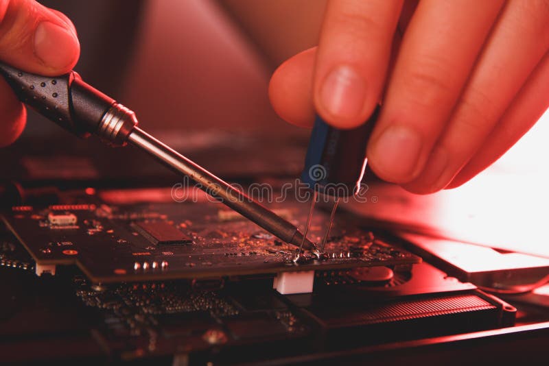 Computer Hardware Engineering. Developer Soldering Electronic Component ...